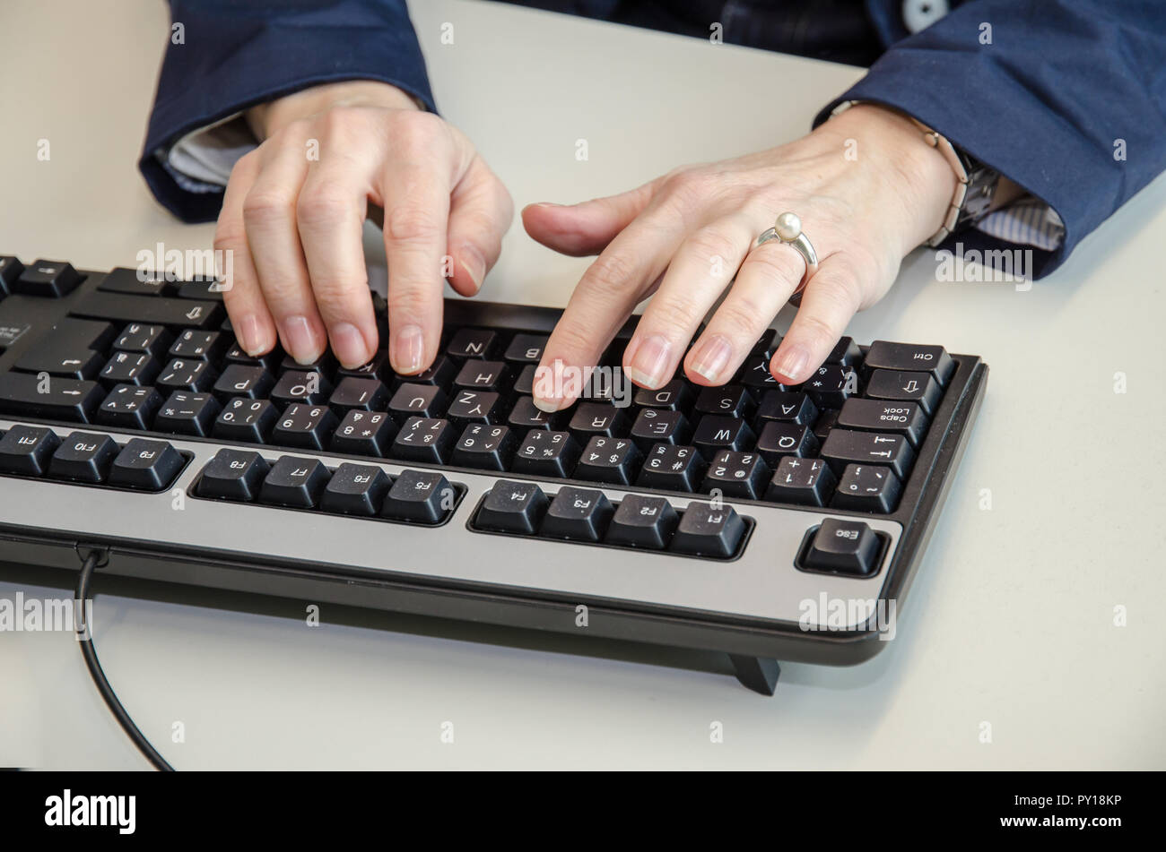 faceless person with hands on keyboard Stock Photo - Alamy