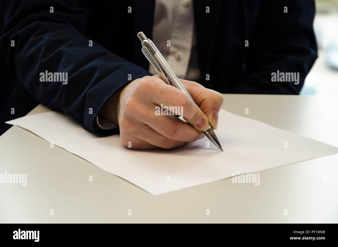 hand with pen filling in a questionnaire Stock Photo - Alamy