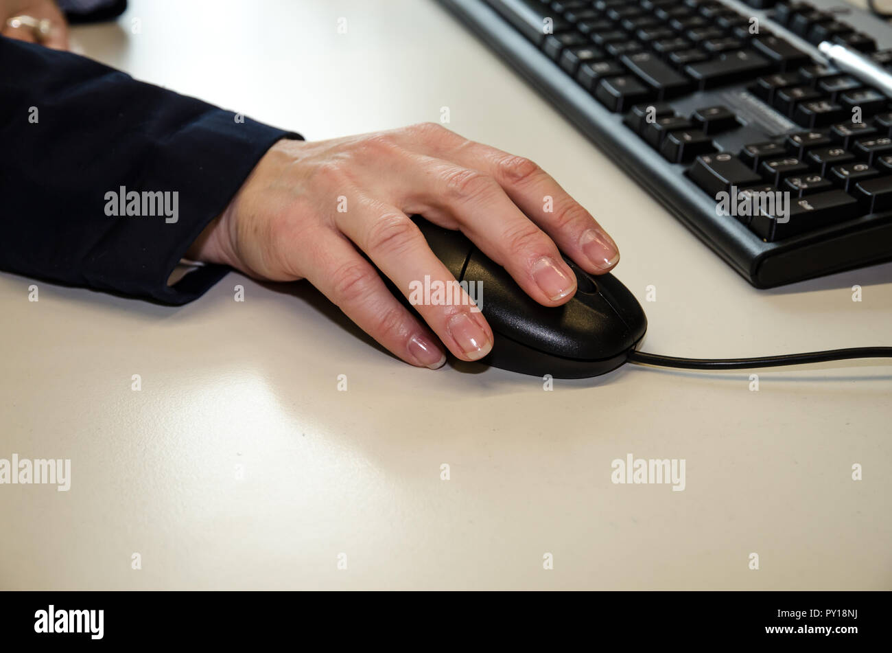 hands on mouse and keyboard Stock Photo - Alamy