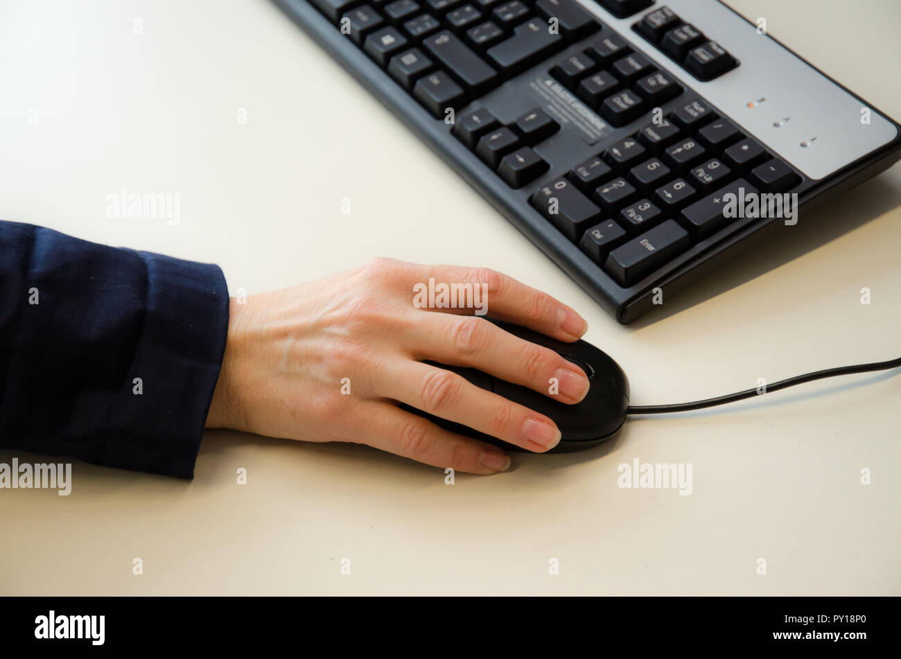 hands on mouse and keyboard Stock Photo - Alamy