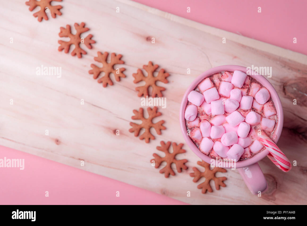 Winter sweets in pink shades, a cup of hot chocolate with mini ...
