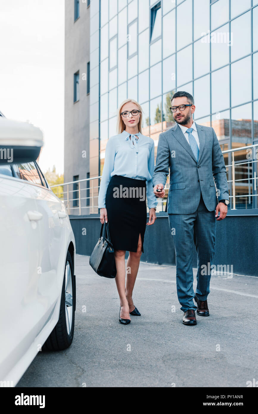 Man walking to car with keys hi-res stock photography and images - Alamy