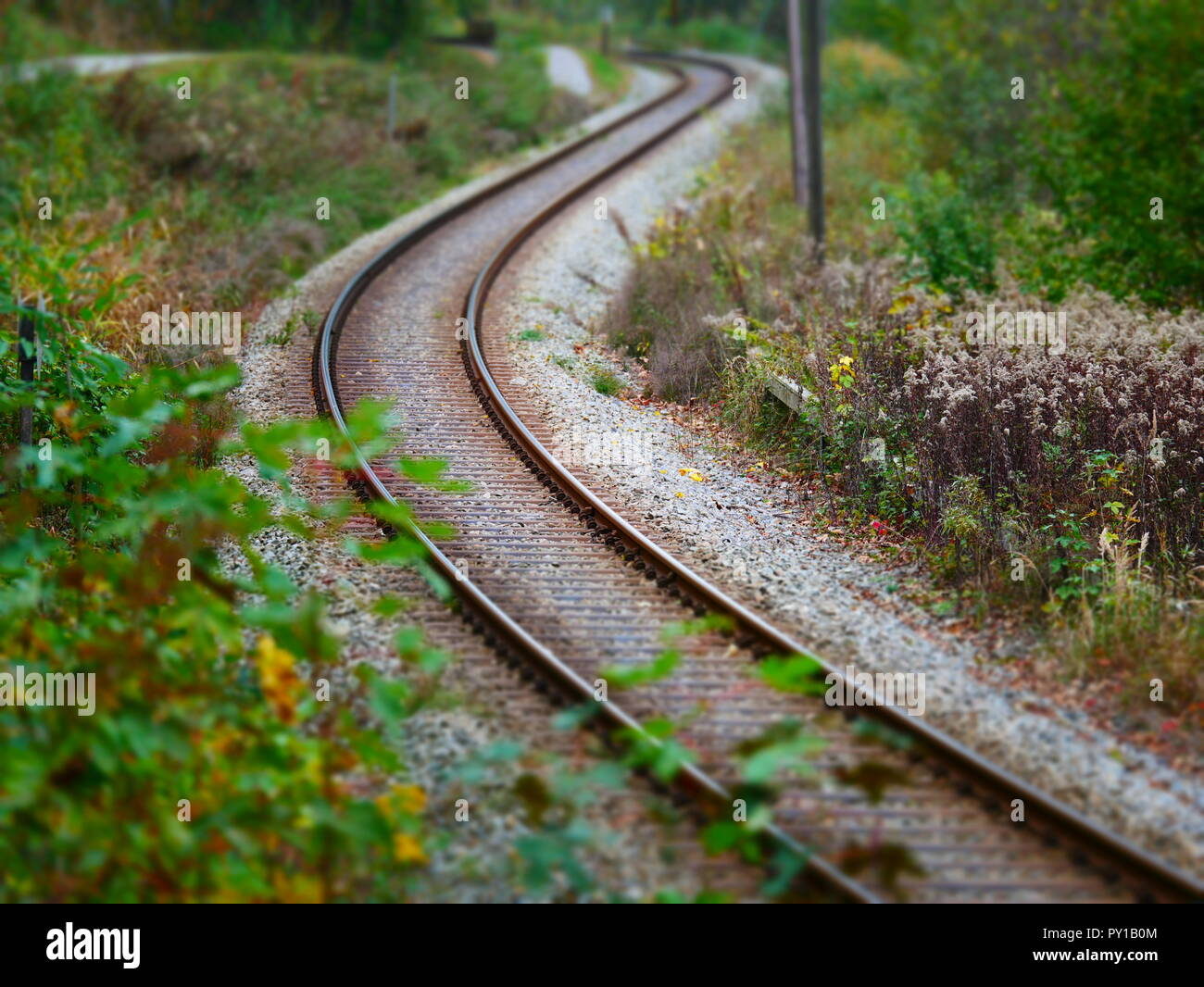 Tilt shift image of winding railroad tracks Stock Photo - Alamy