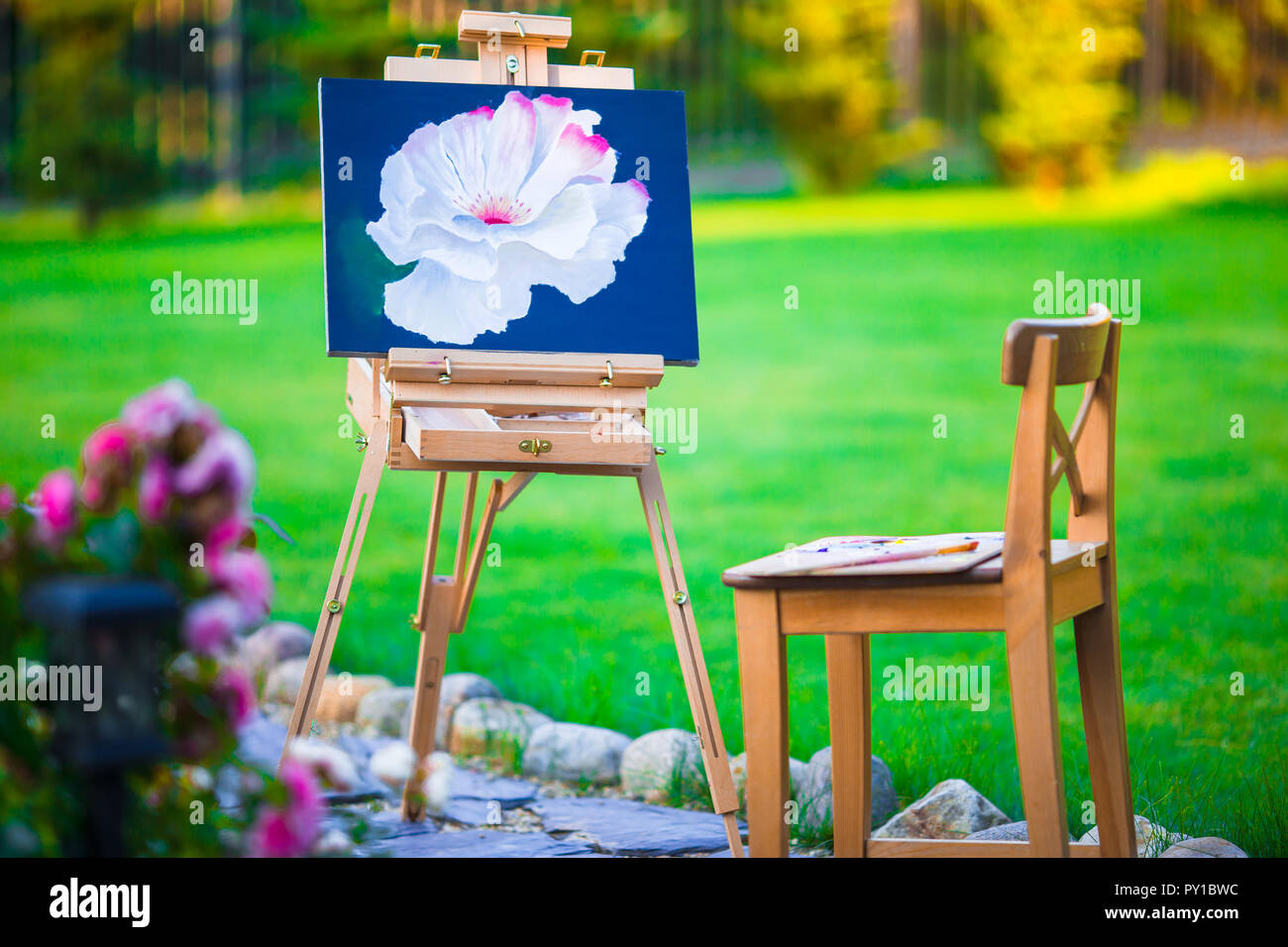 Closeup an easel with beautiful picture in beautiful garden Stock Photo ...