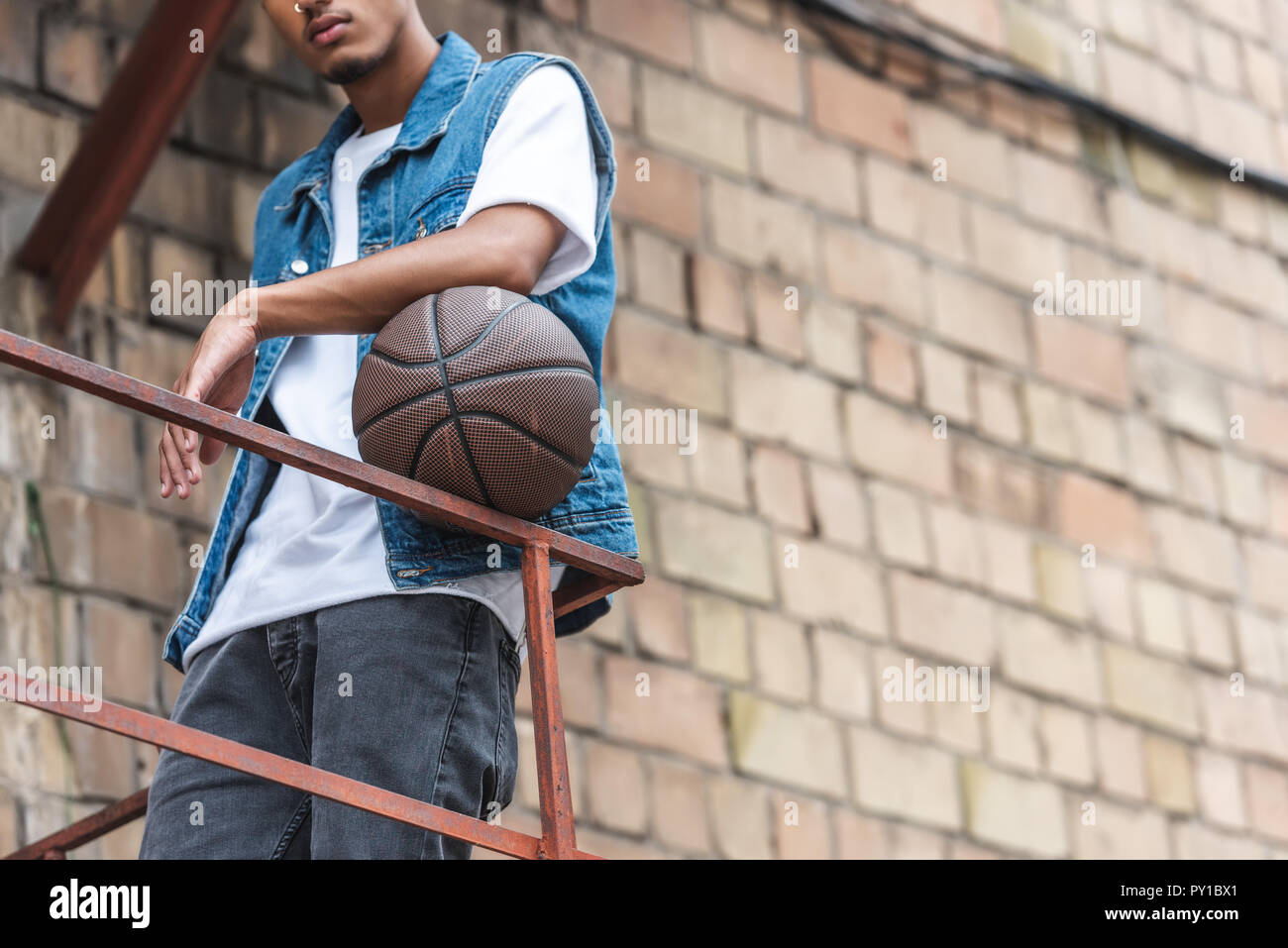 Young stylish man standing hi-res stock photography and images - Alamy
