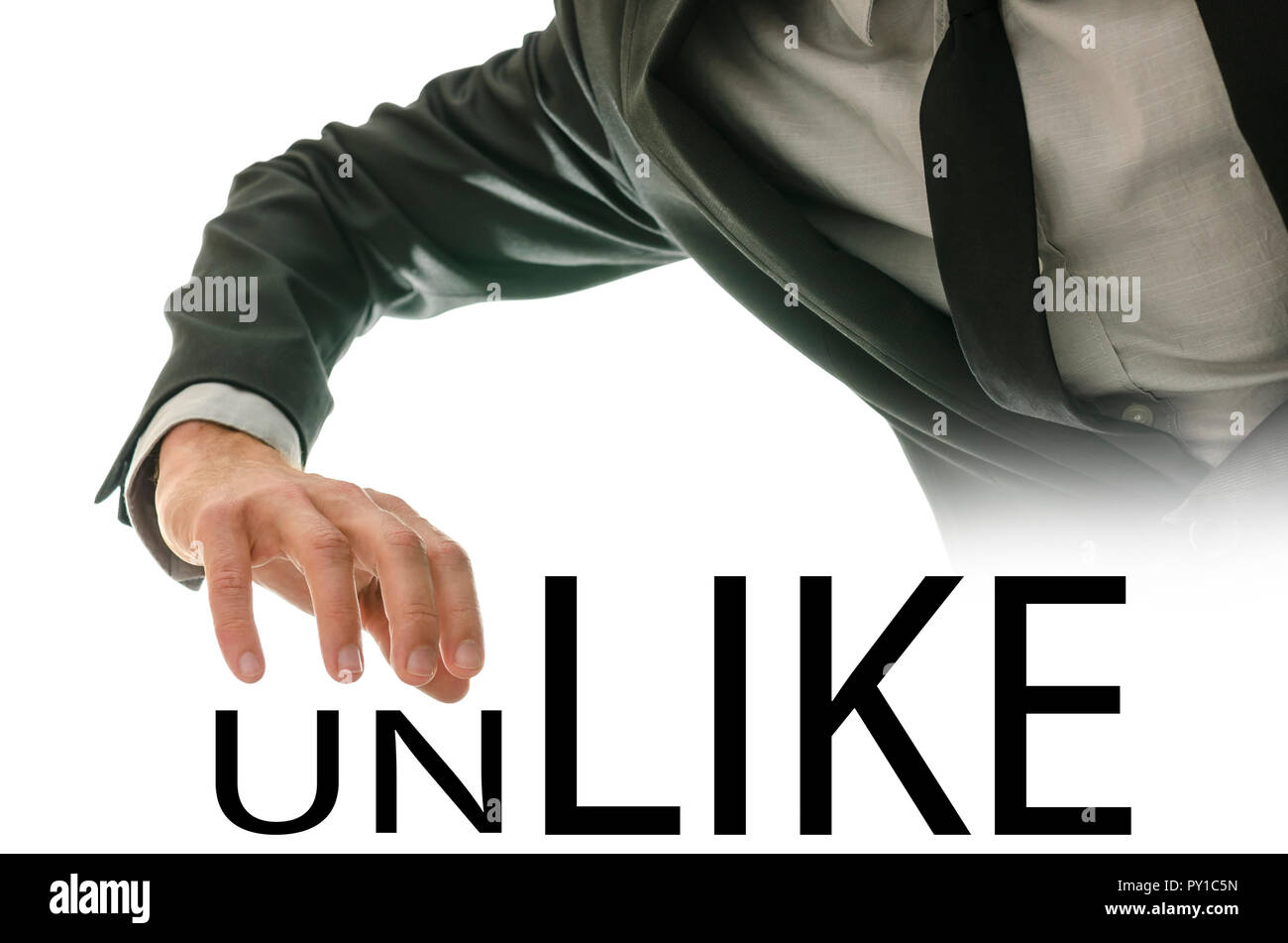 Changing word Unlike into Like by pushing away letters un Stock Photo ...