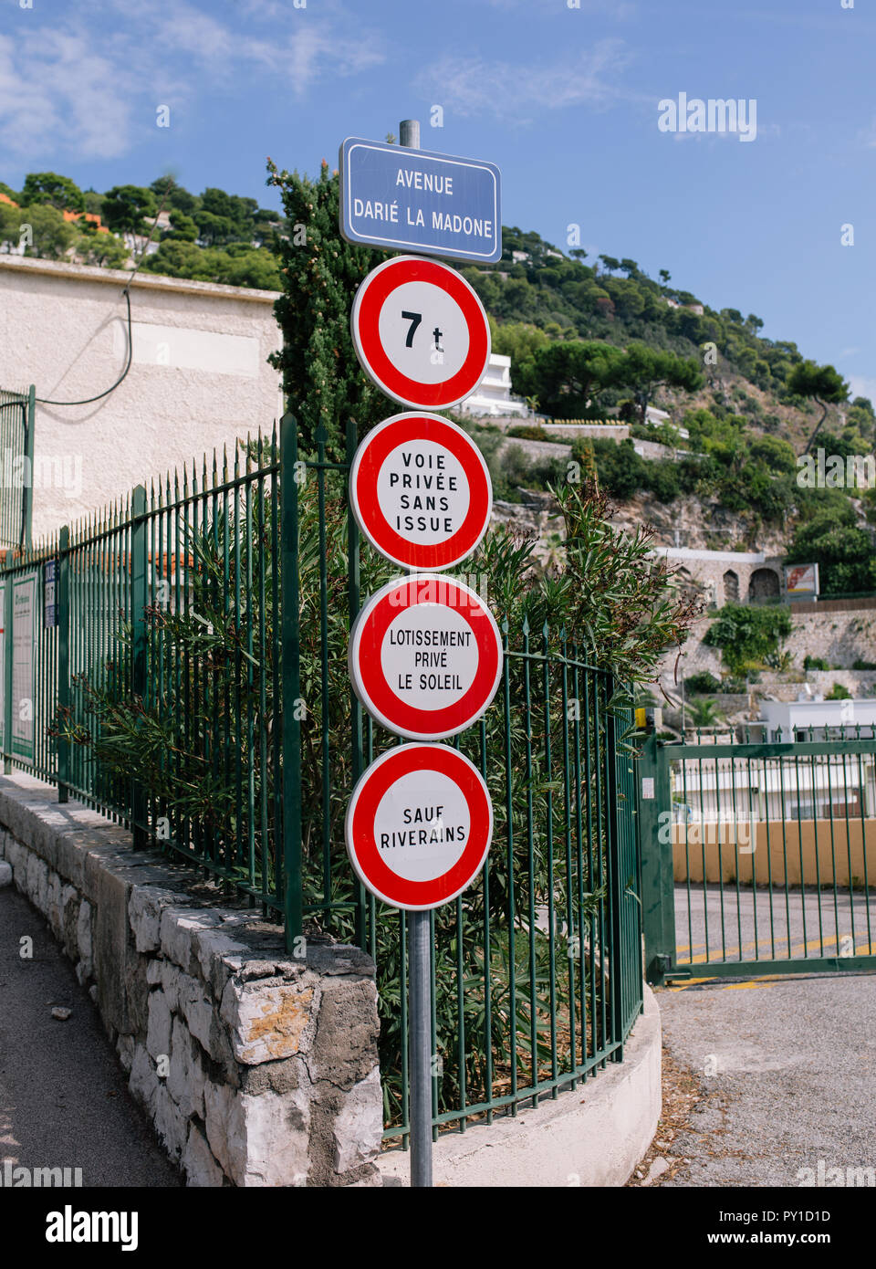 Road signs on the street of the southern European city Stock Photo - Alamy