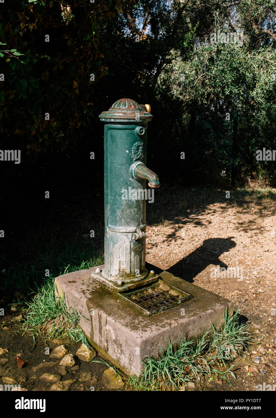 Water column in the street with concrete base and flowing water Stock ...