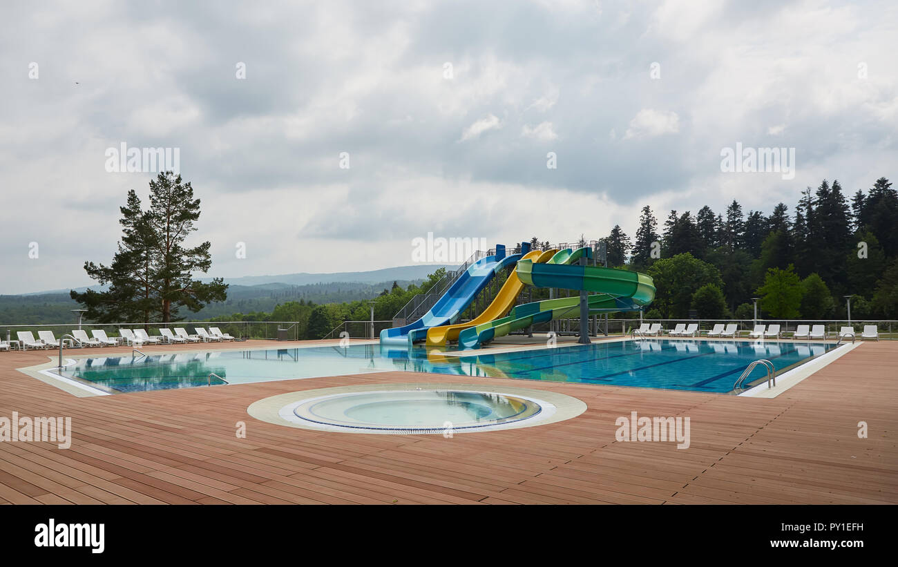 swimming pool on luxury resort in forest Stock Photo - Alamy