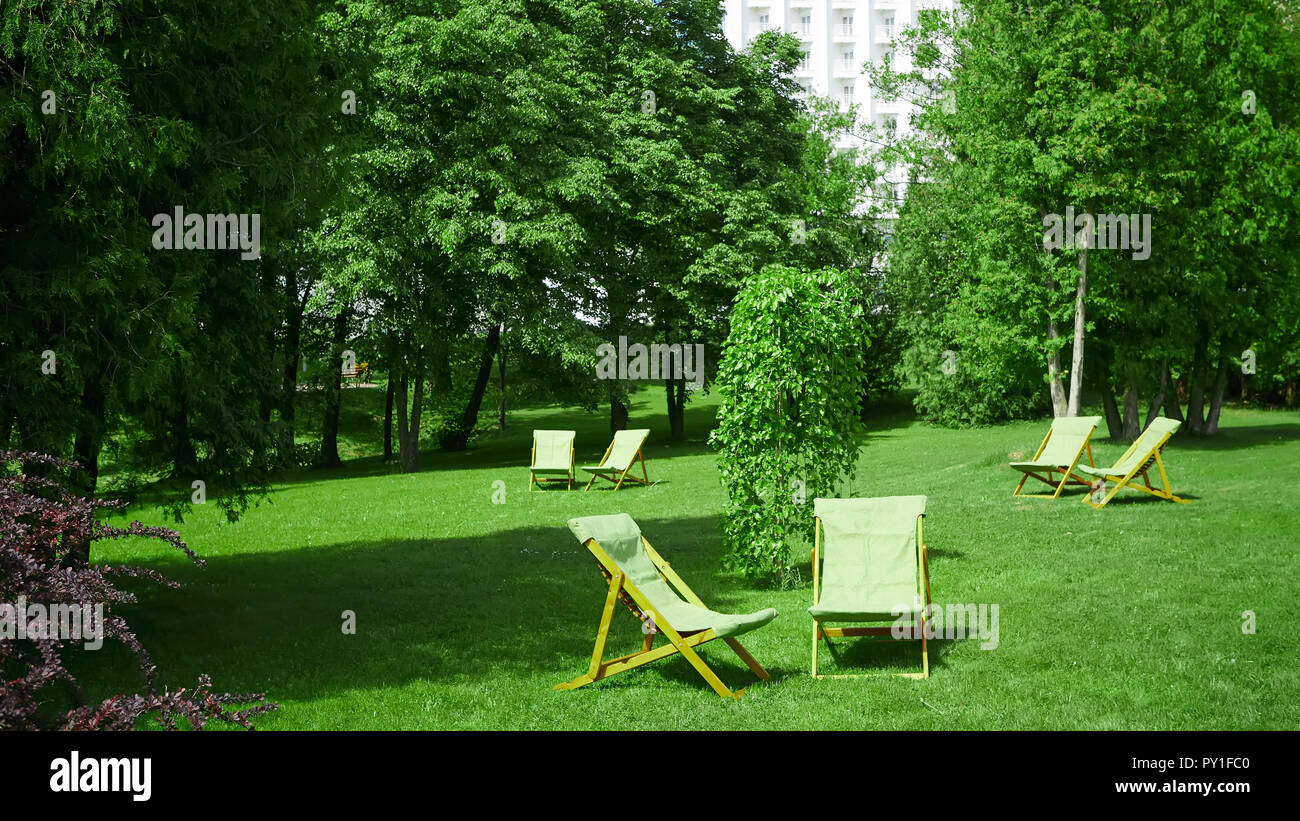Rest chairs in the garden. Resort concept Stock Photo - Alamy