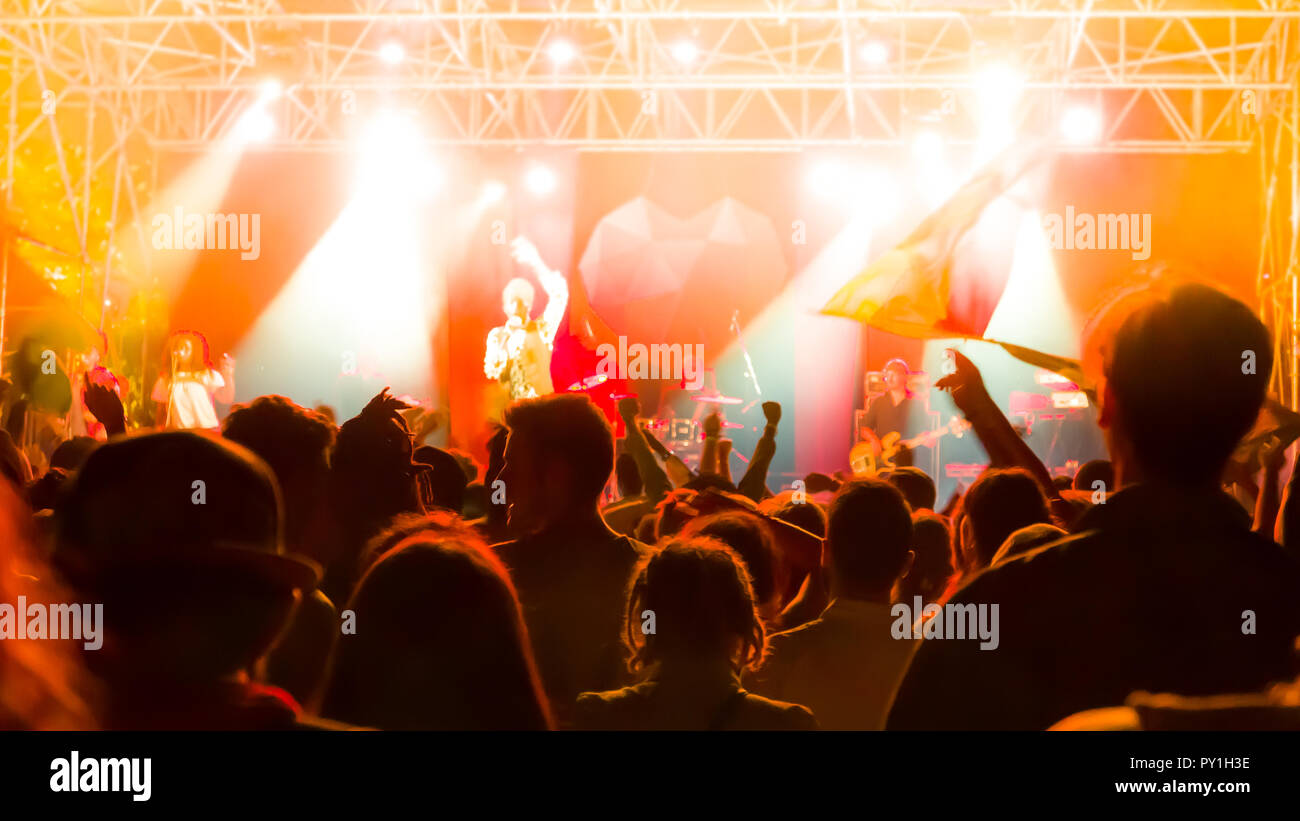 Concert crowd against bright stage lights Stock Photo - Alamy