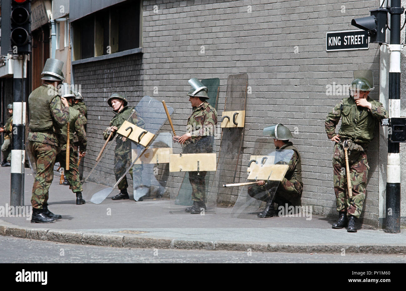 British Army soldiers in riot gear on a street corner in Belfast City ...