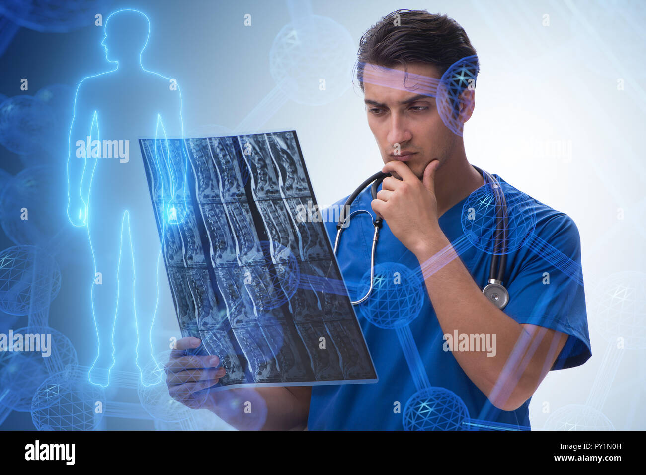 Young doctor looking at x-ray image in mhealth concept Stock Photo - Alamy
