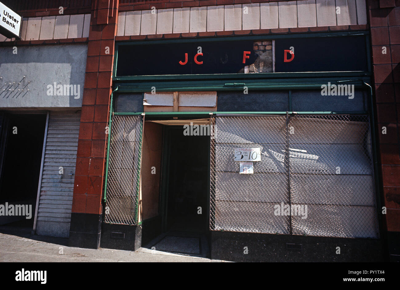 Belfast, 1973: boarded shop front during The Trouble, Northern Ireland ...