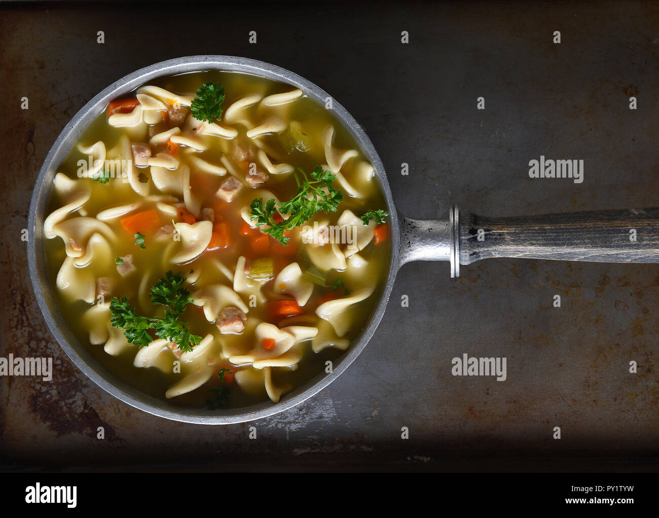 Top view of a pot of fresh homemade, Chicken Noodle Soup. Horizontal ...