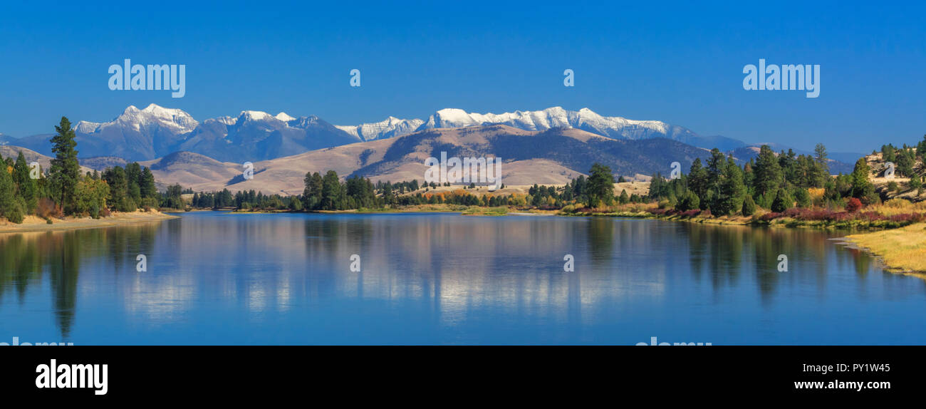 panorama of the flathead river in autumn below the mission mountains ...