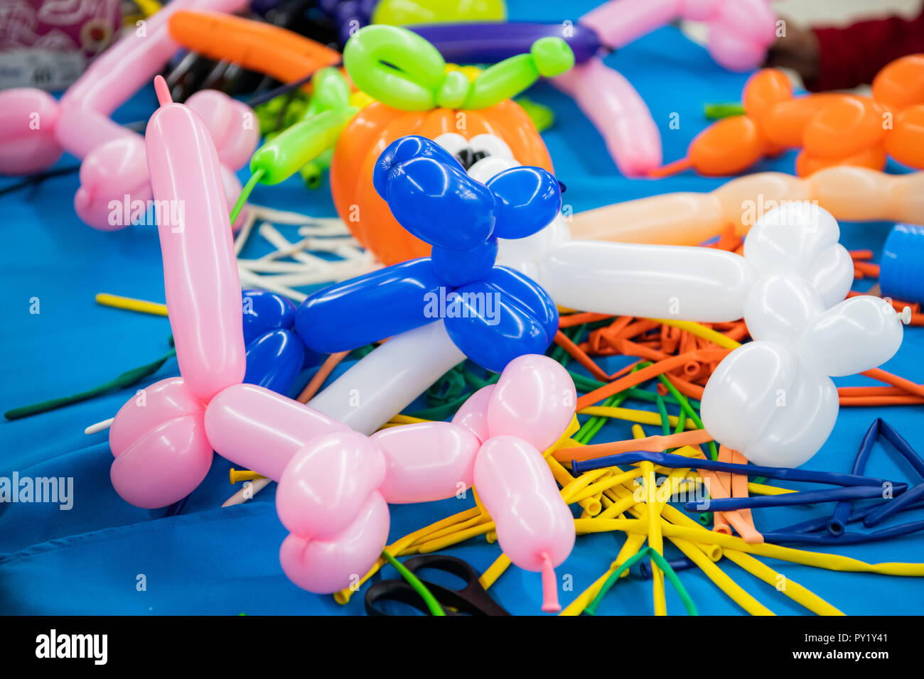 Balloon twisting art children workshop colorful still Stock Photo - Alamy