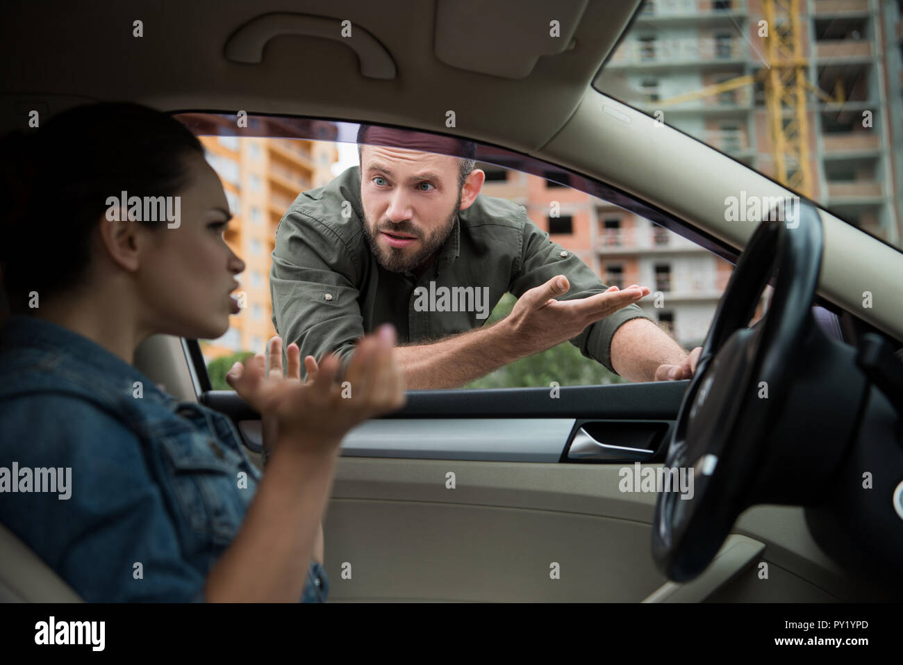 angry man gesturing to driver through car window Stock Photo - Alamy