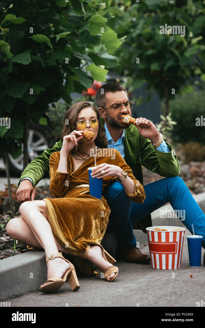 Glamorous woman eating chicken hi-res stock photography and images - Alamy