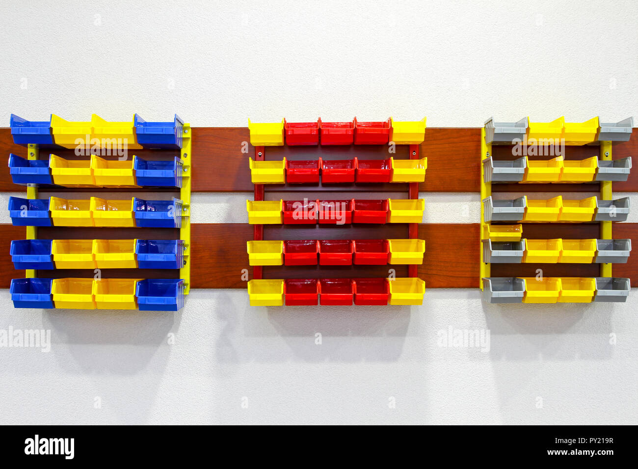 Open plastic boxes wall shelves in storehouse Stock Photo - Alamy