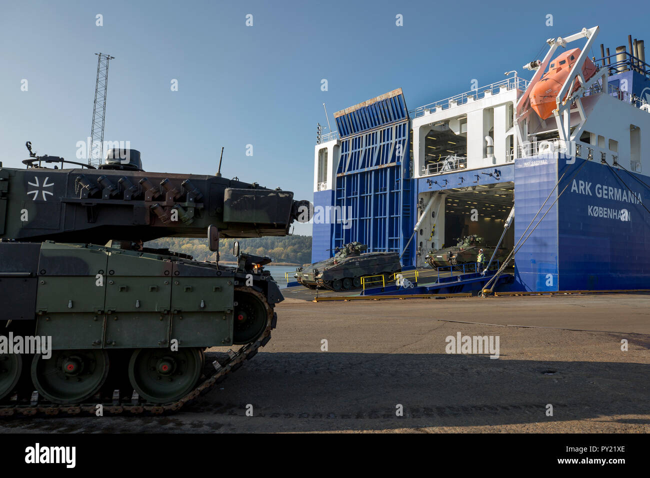 Unloading of main battle tank Leopard 2 and infantry combat vehicles ...
