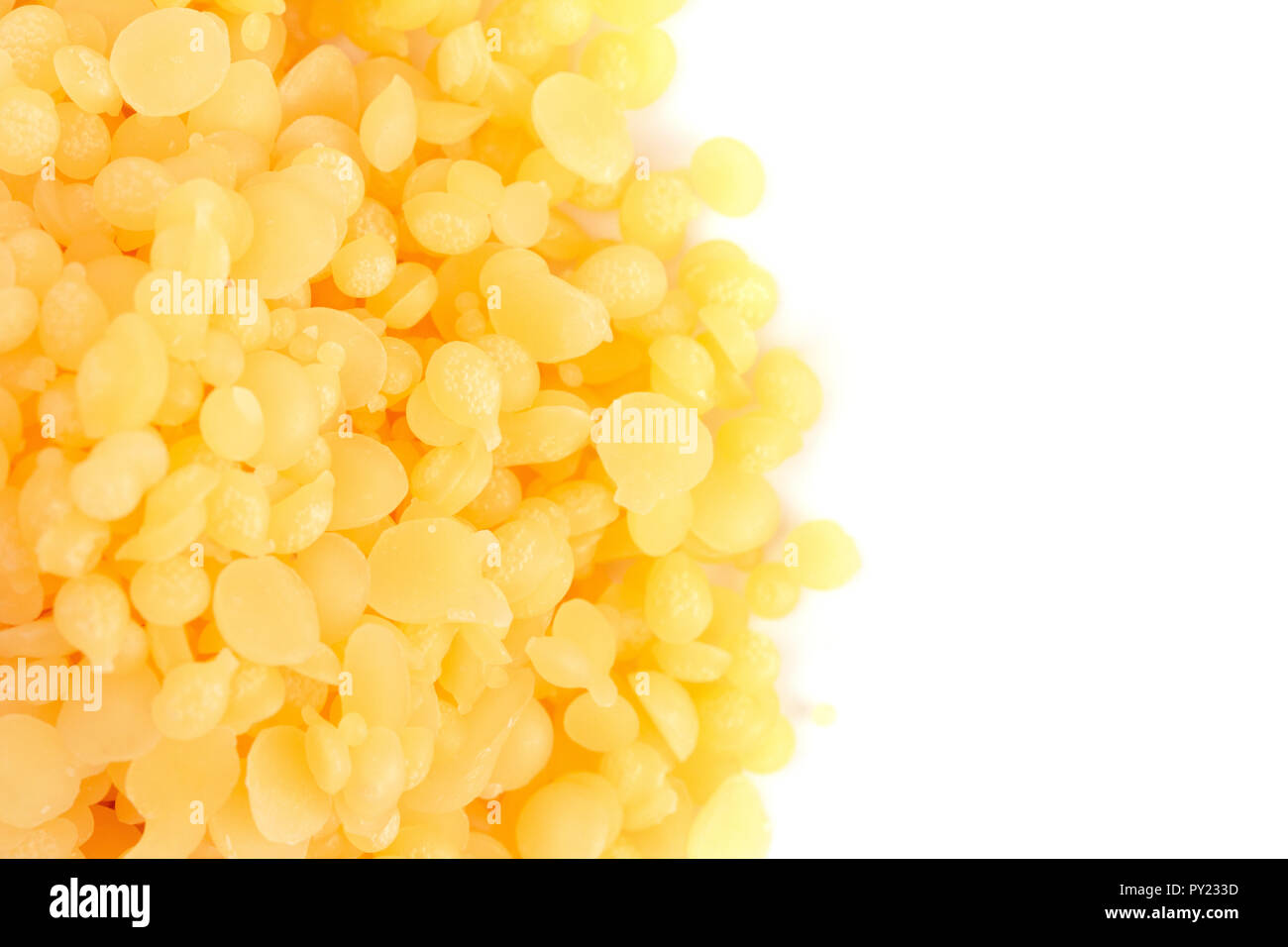 A Pile of Natural Yellow Beeswax Pearls on a Wax Background Stock Photo ...