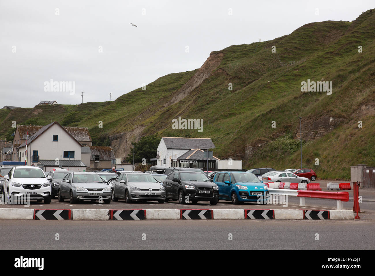 Cars waiting to board the NorthLink car ferry Hamnavoe at Scrabster for ...