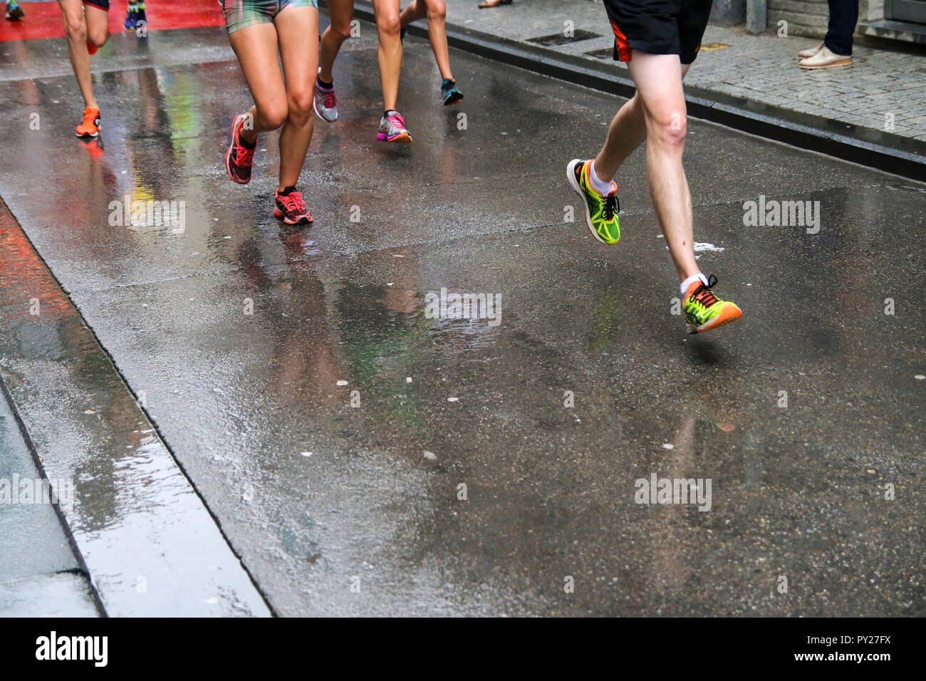 Running in the rain hi-res stock photography and images - Alamy