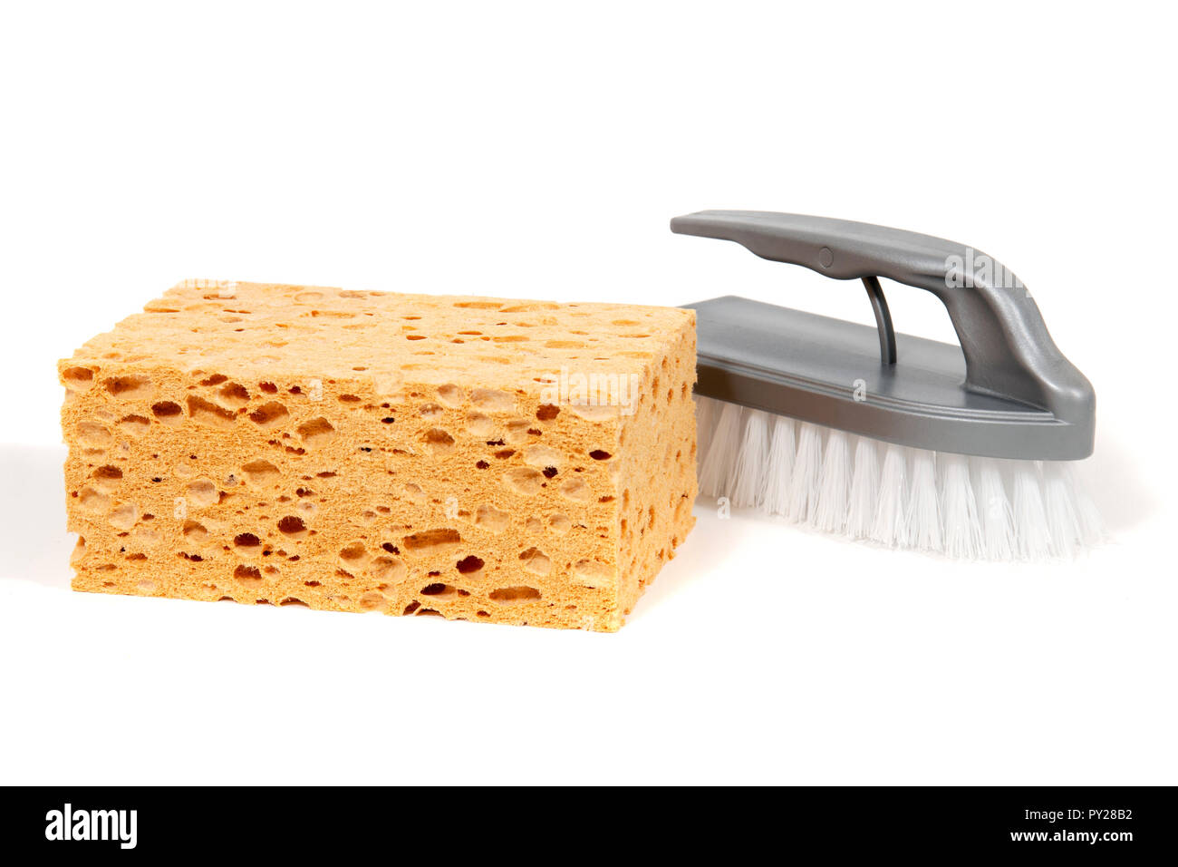 Big porous sponge with scrubbing brush isolated on white background ...