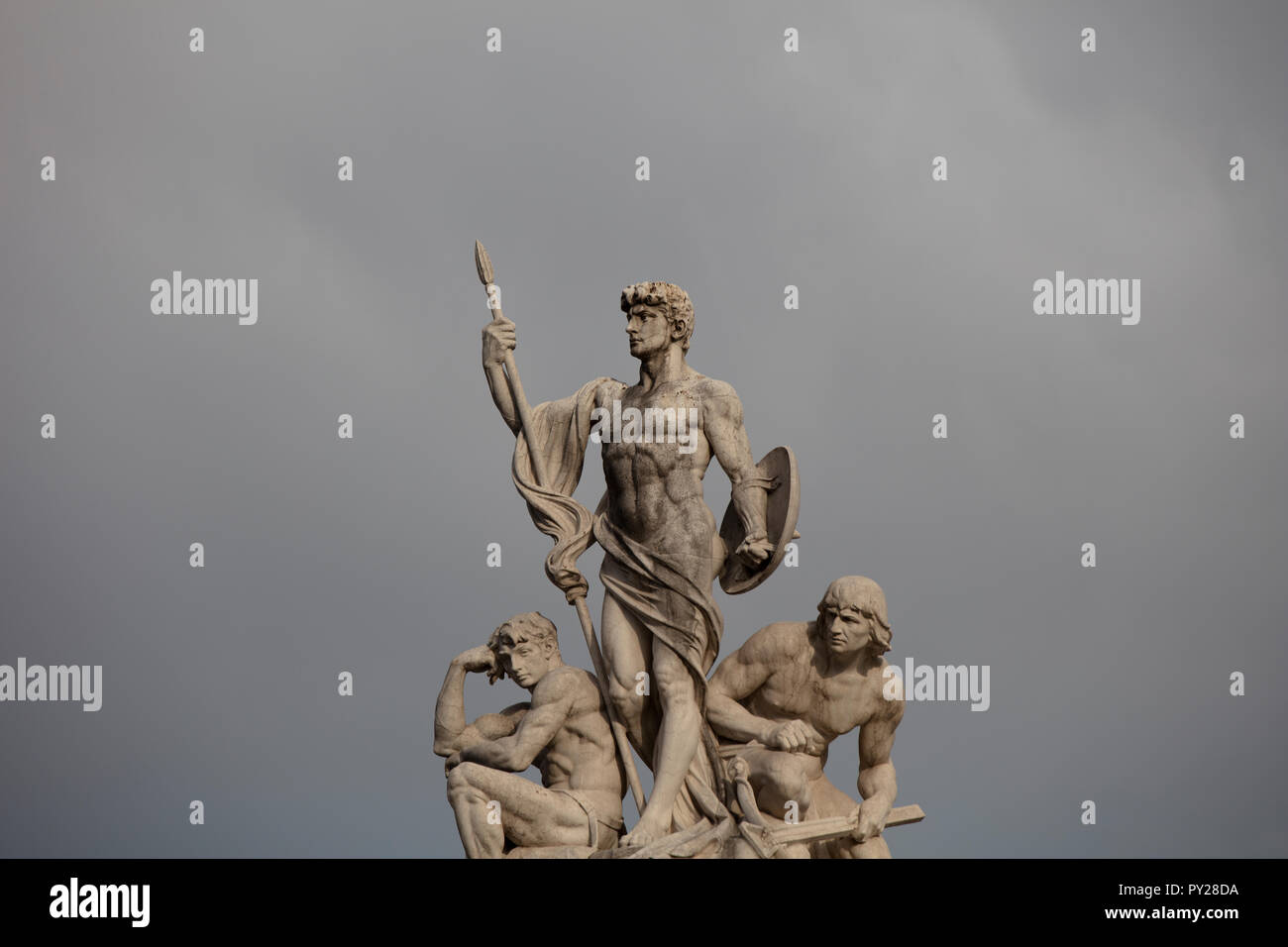 Evening sunlight shining on the statue depicting strength against a ...