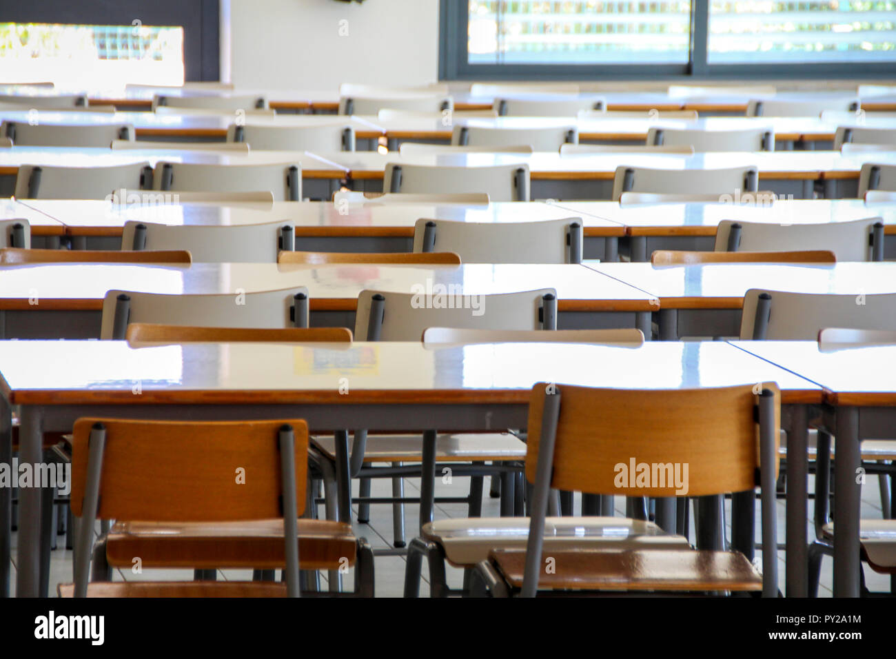 Interior view of an empty school canteen with tables and chairs Stock ...