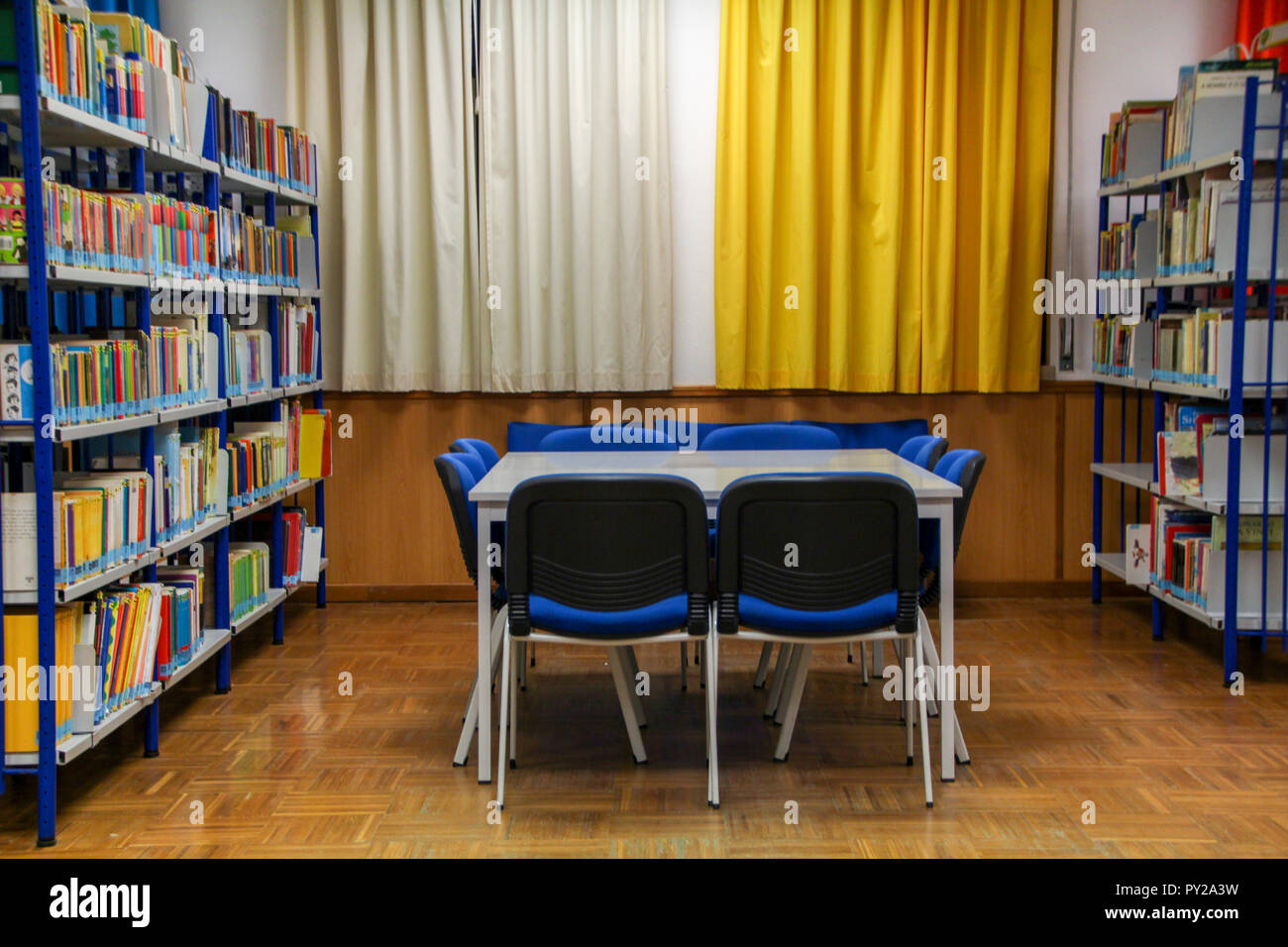 Interior view of a school library with books and table for study Stock ...