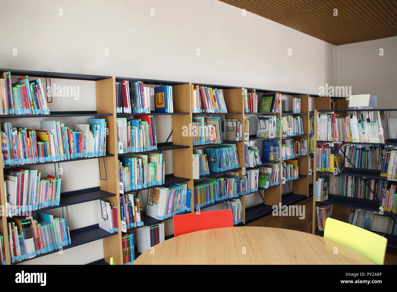 Interior view of a school library with books and table for study Stock ...