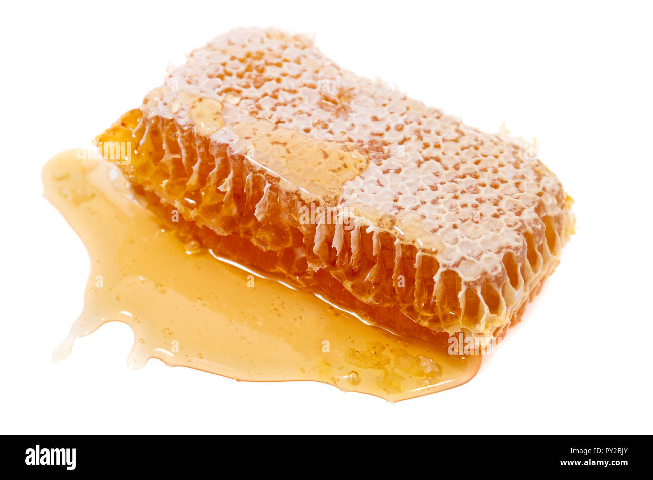 sweet honeycomb piece isolated on a white background Stock Photo - Alamy