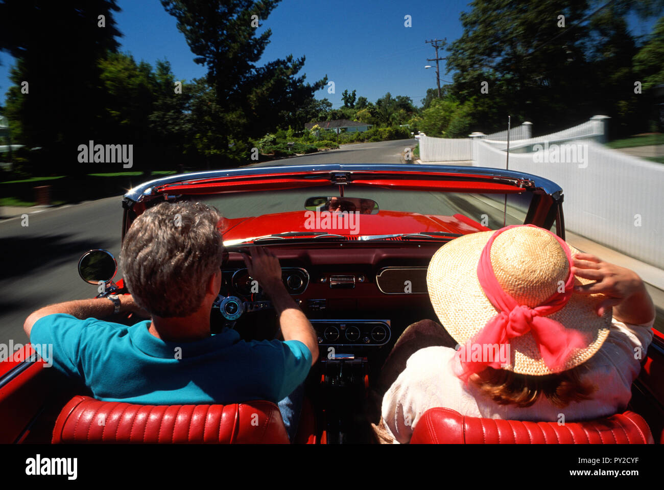 Middle Aged Couple Enjoying a Ride in a Vintage 1966 Mustang ...