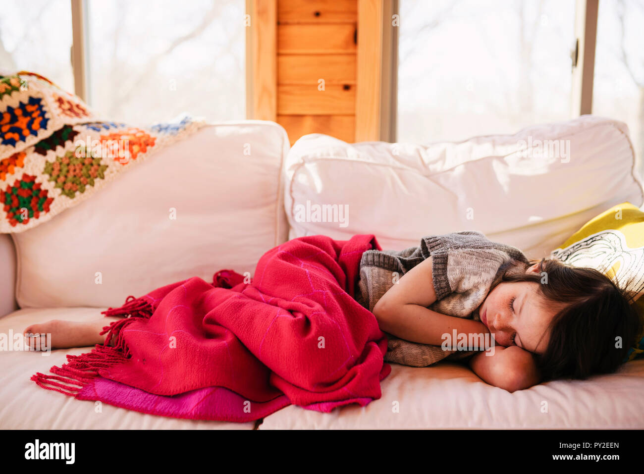 Barefoot girl lying on couch hi-res stock photography and images - Alamy