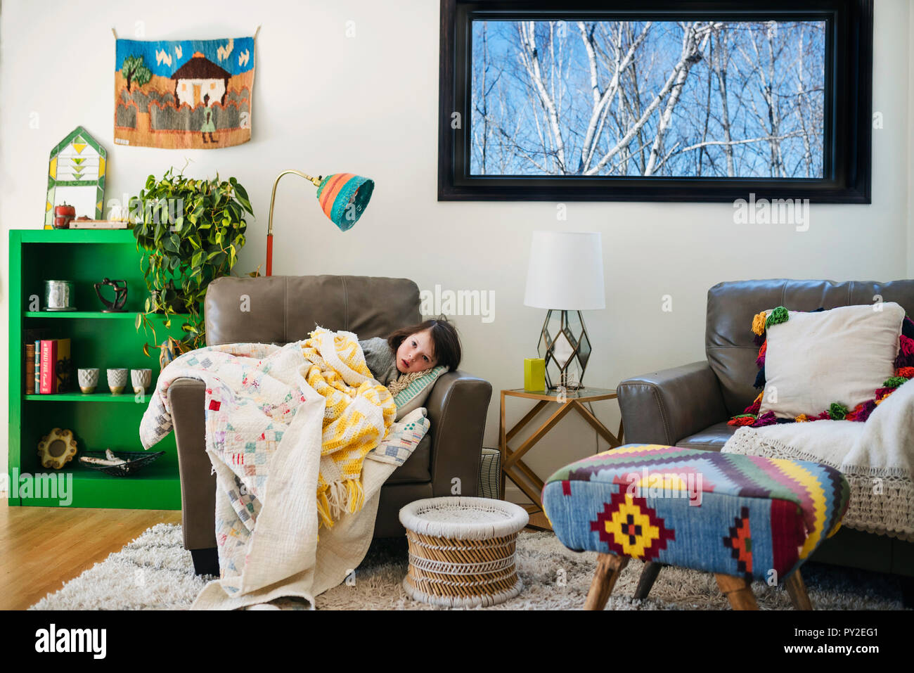 Child curled up blanket hi-res stock photography and images - Alamy