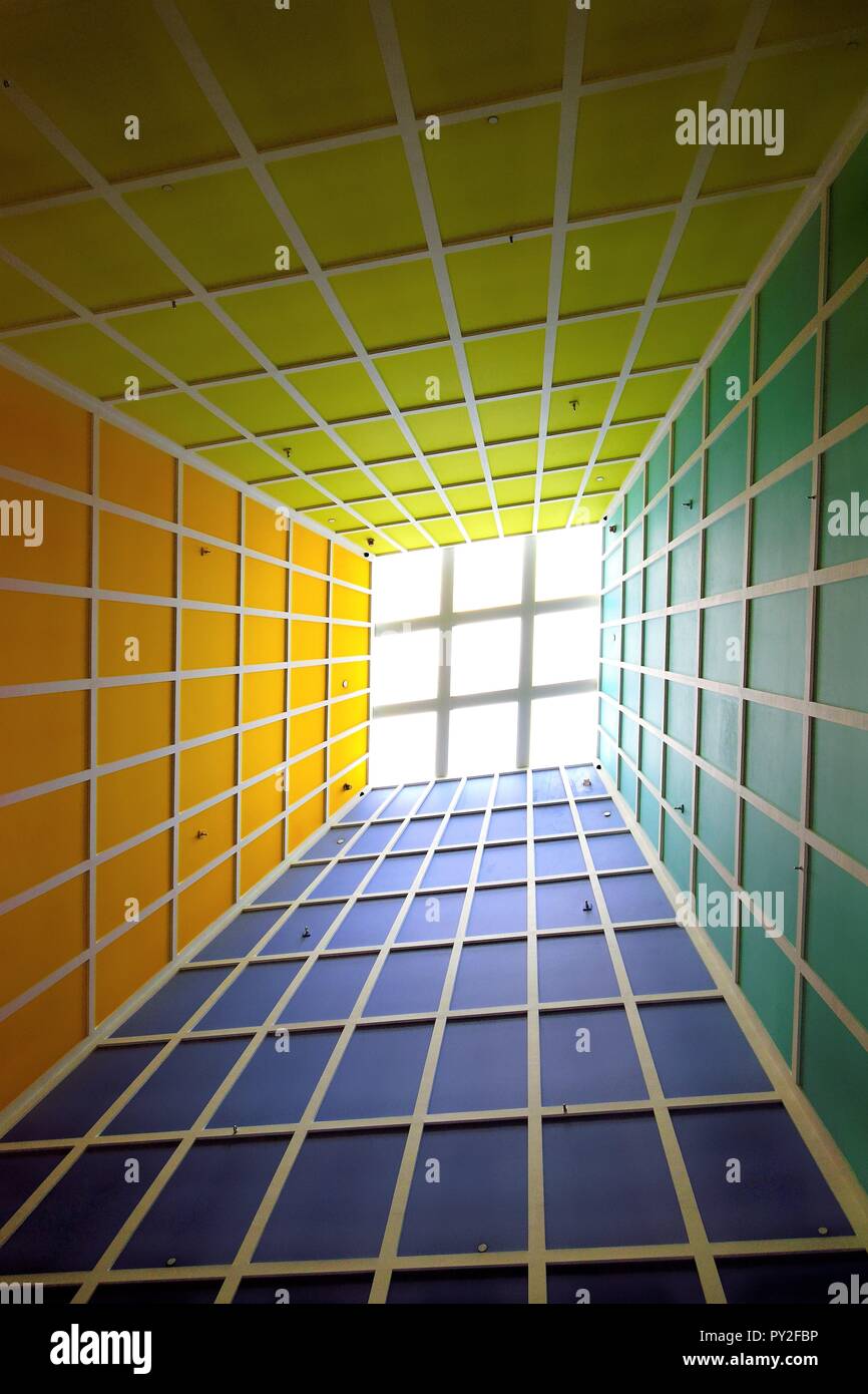 Abstract perspective of vertical lobby ceiling with skylight and strong ...