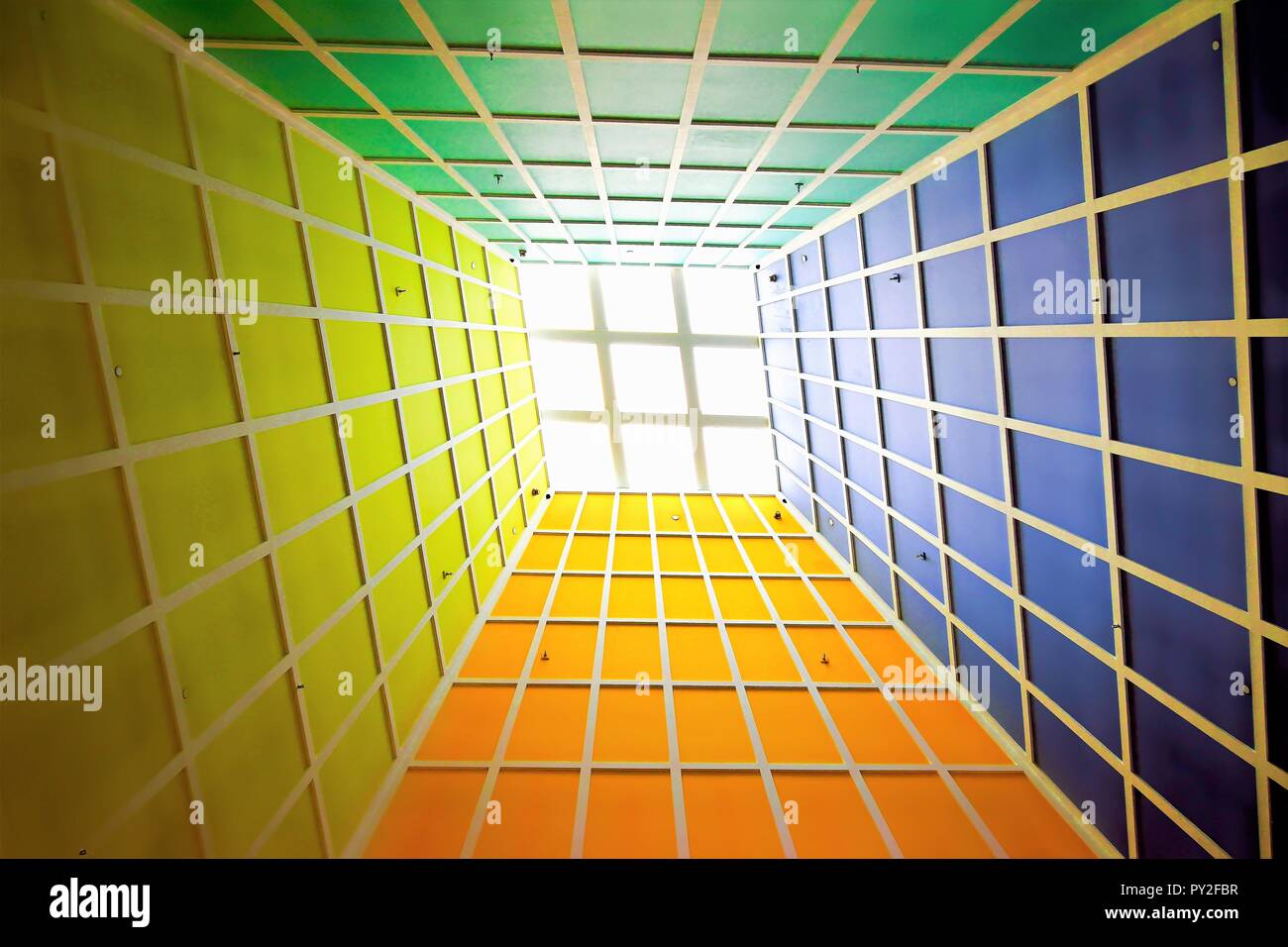 Abstract perspective of vertical lobby ceiling with skylight and strong ...