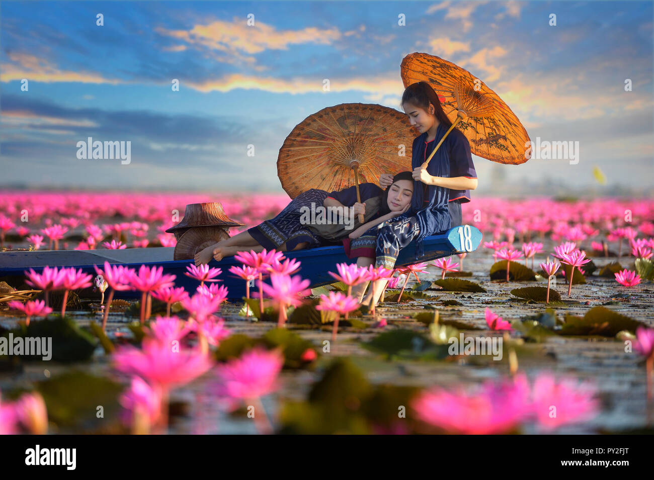 Asian sitting on a boat hi-res stock photography and images - Alamy