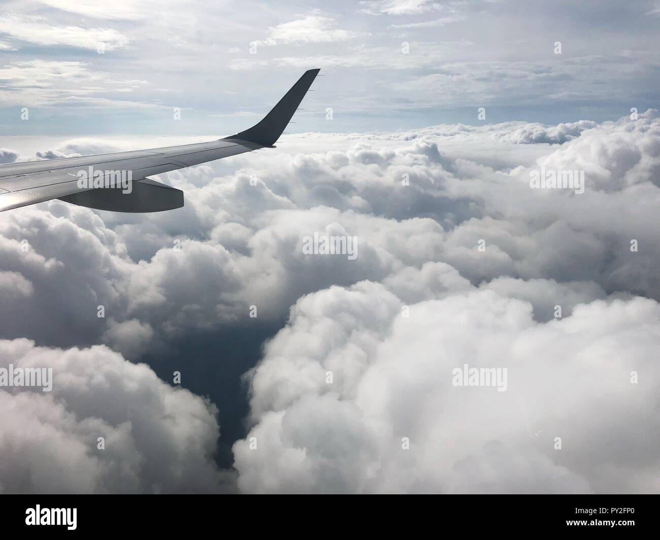 Aircraft flying through the clouds Stock Photo - Alamy