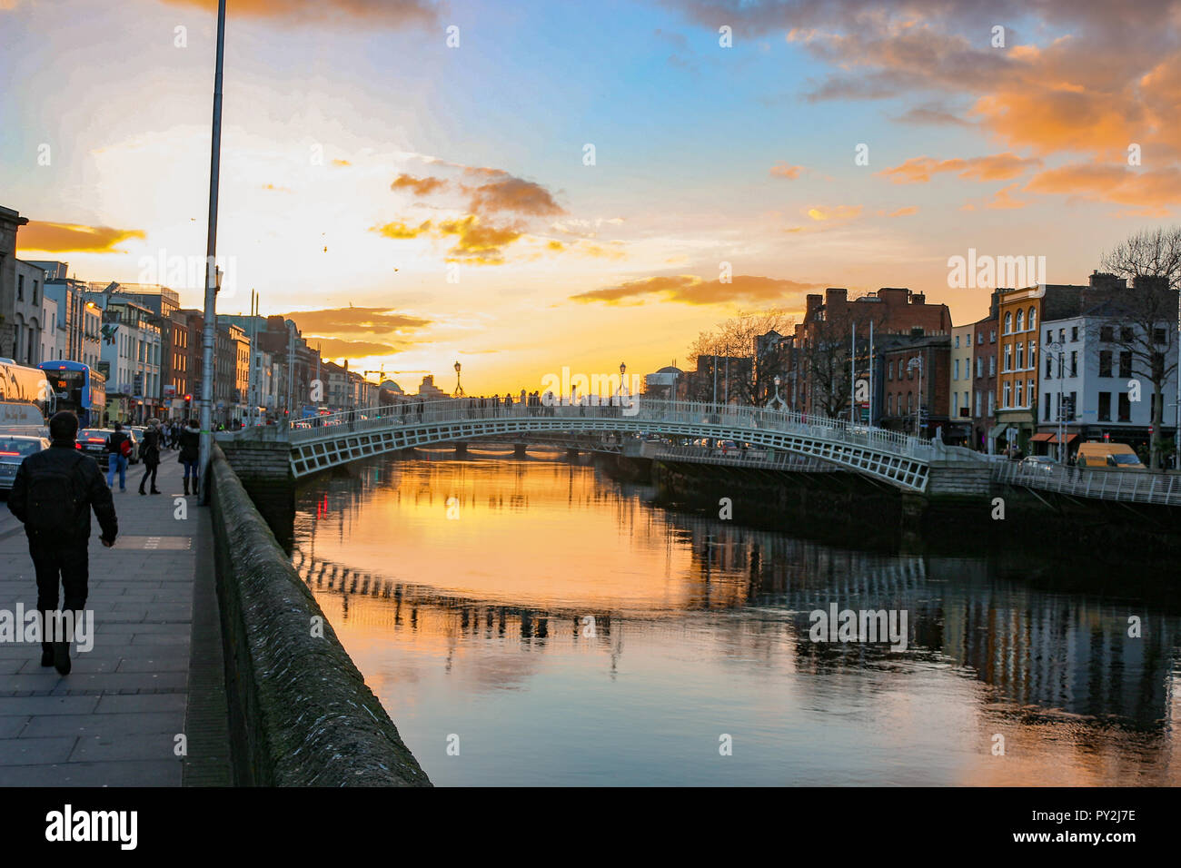 Dublin night scene with Ha'penny bridge and Liffey river lights Stock ...