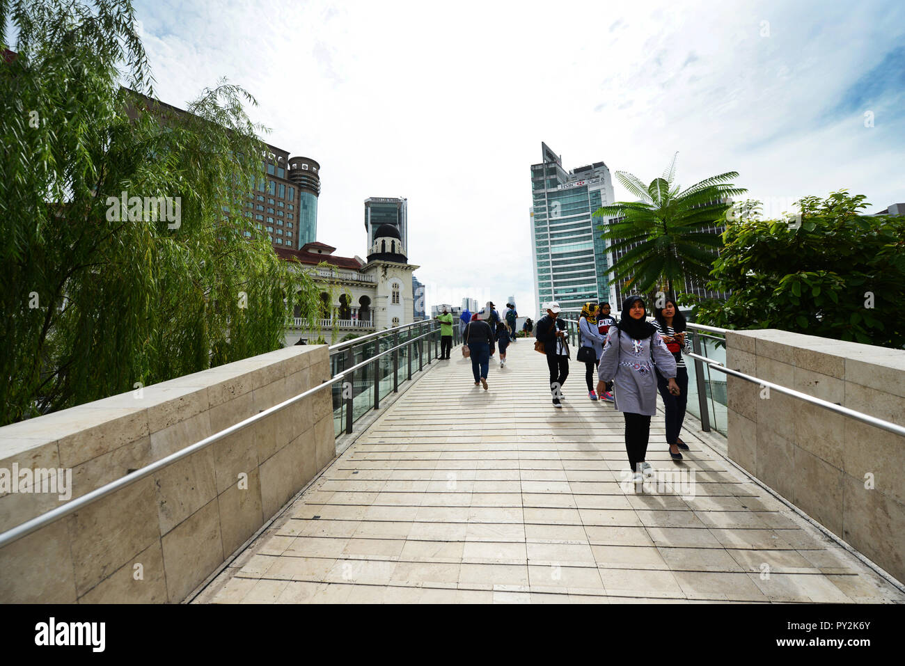 The pedestrian bridge crossing the Klang river near the Jamek mosque in ...