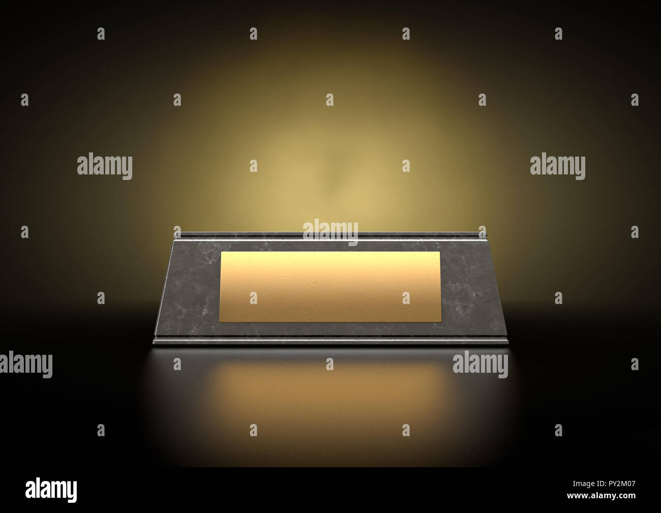 An empty black marble trophy base with a blank golden plaque on an ...