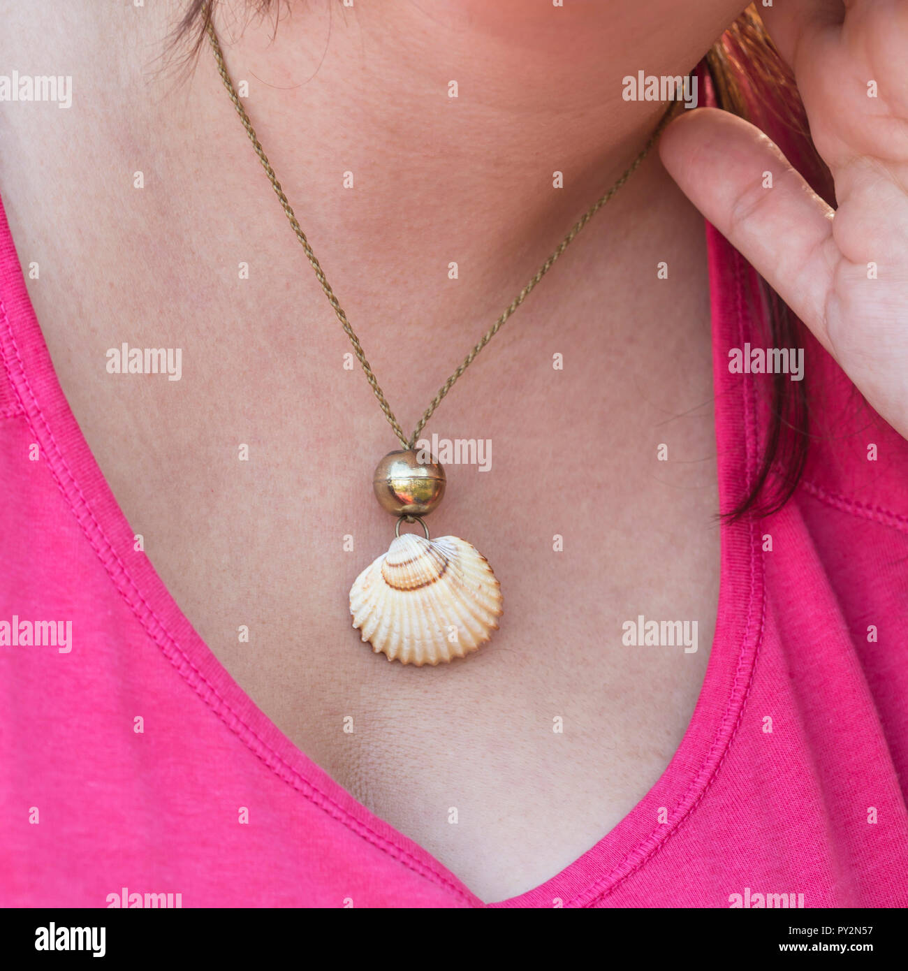 woman wearing shell component necklace Stock Photo - Alamy