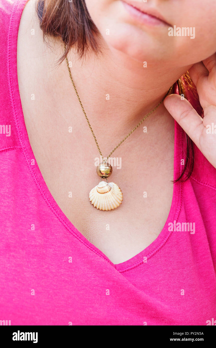 woman wearing shell component necklace Stock Photo - Alamy