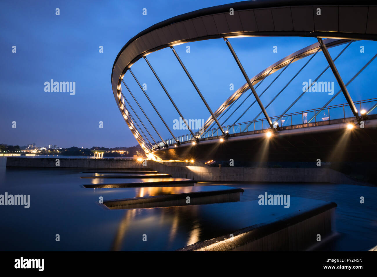 Curve bridge with dam water gate Stock Photo - Alamy