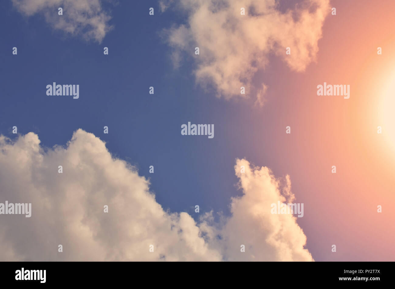Nature background. Fluffy soft clouds in sky toned Stock Photo - Alamy