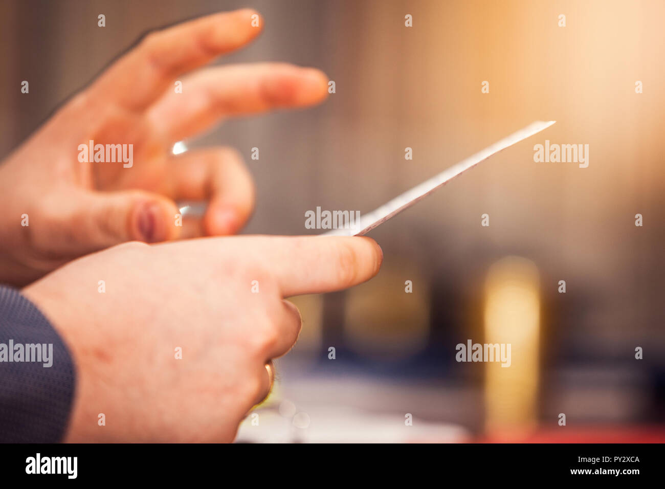 Reading notes in front of audience Stock Photo - Alamy