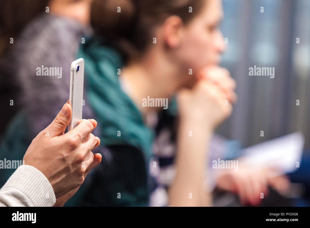 Using mobile phones in class, taking a photo Stock Photo - Alamy